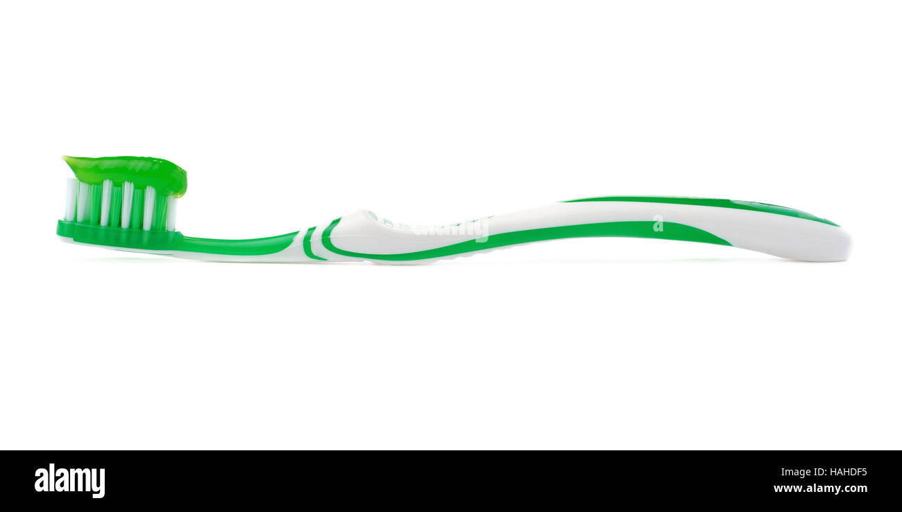 Green toothbrush with paste isolated over white background Stock Photo ...
