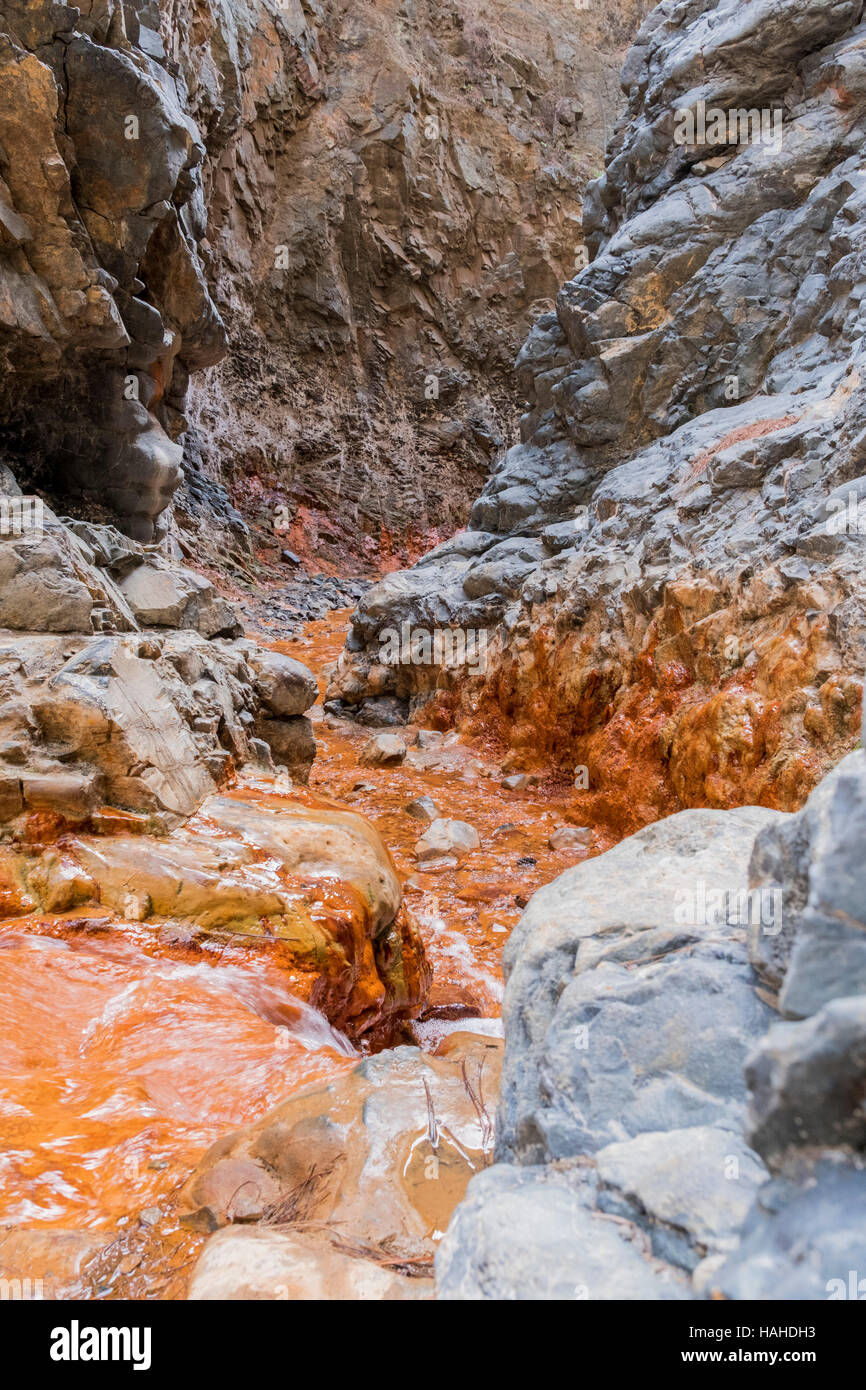 "Cascada de los Colores" river with its golden color in Caldera de ...