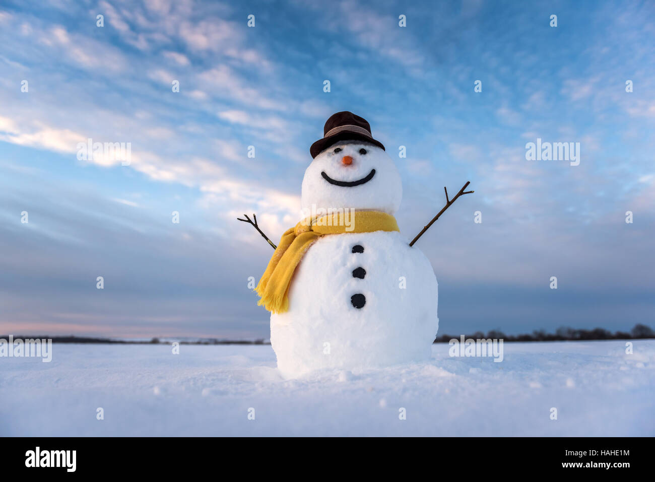 snowman on blue sky background Stock Photo - Alamy