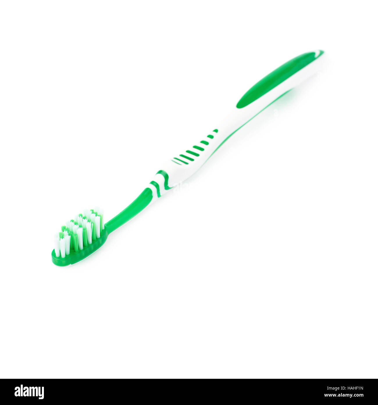 Green toothbrush isolated over white background Stock Photo - Alamy