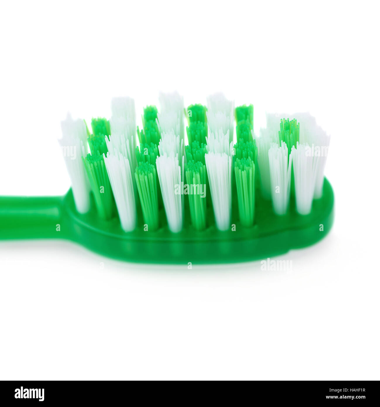 Green toothbrush isolated over white background Stock Photo - Alamy