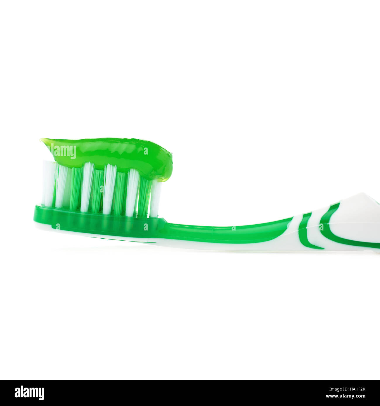 Green toothbrush with paste isolated over white background Stock Photo ...