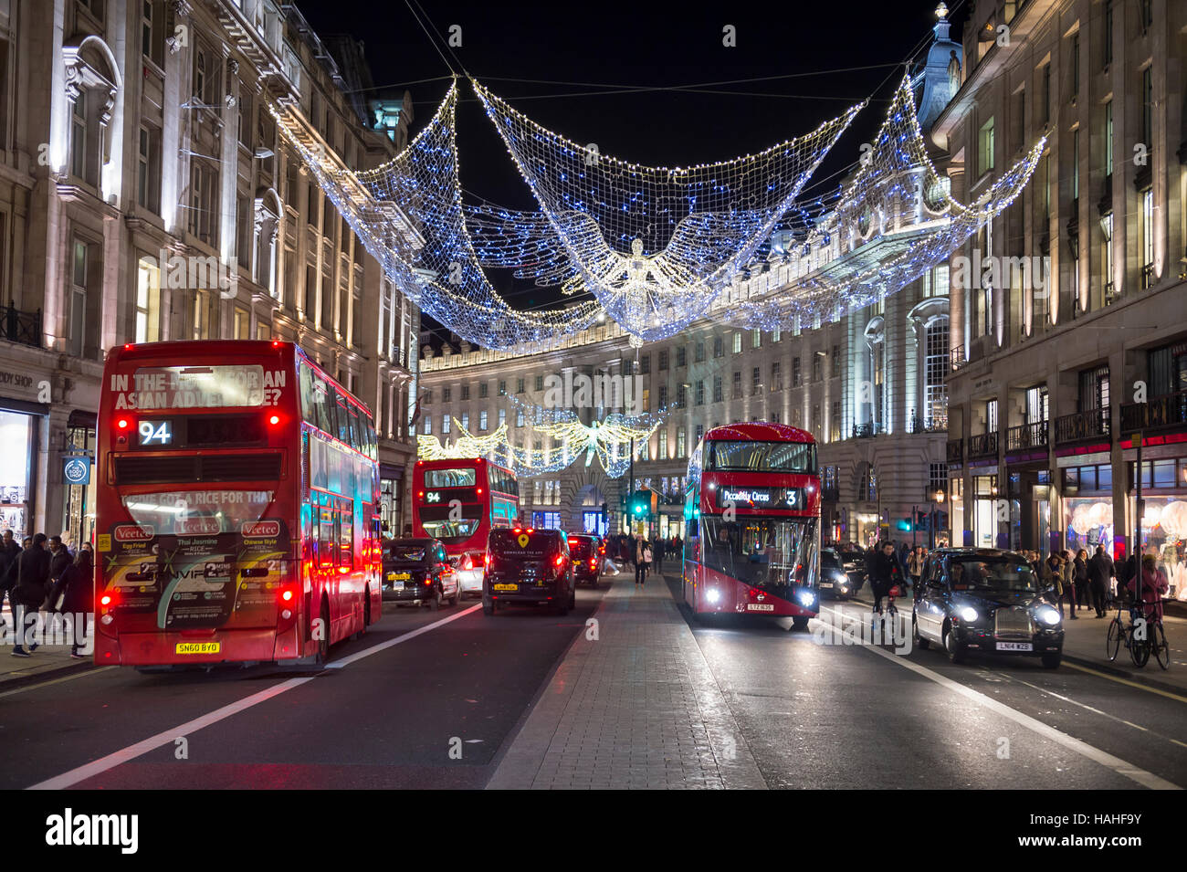 LONDON - NOVEMBER 18, 2016: Red double-decker buses pass under ...