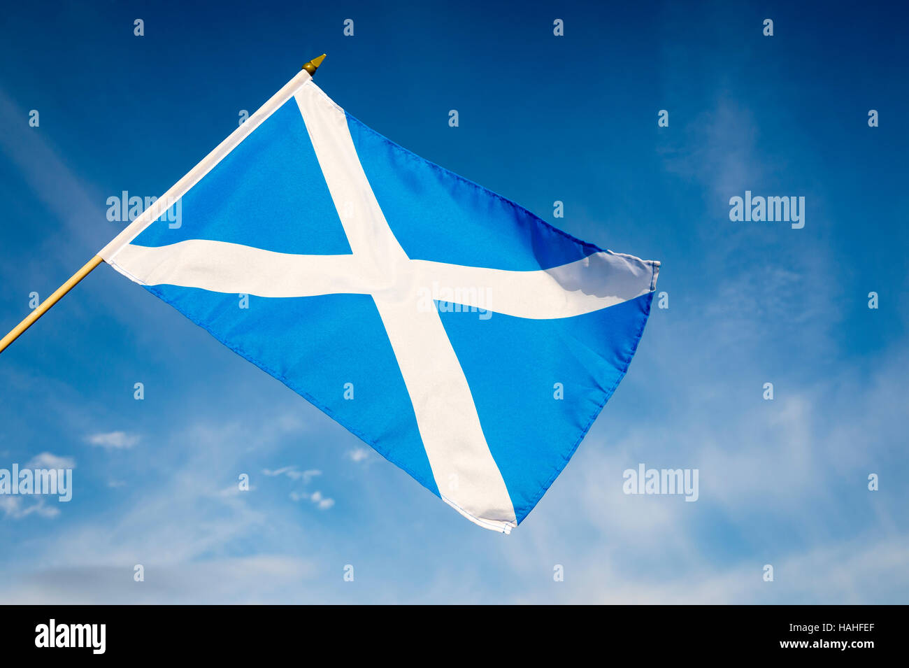 Scottish flag, also known as St Andrew's Cross, flying in bright blue ...