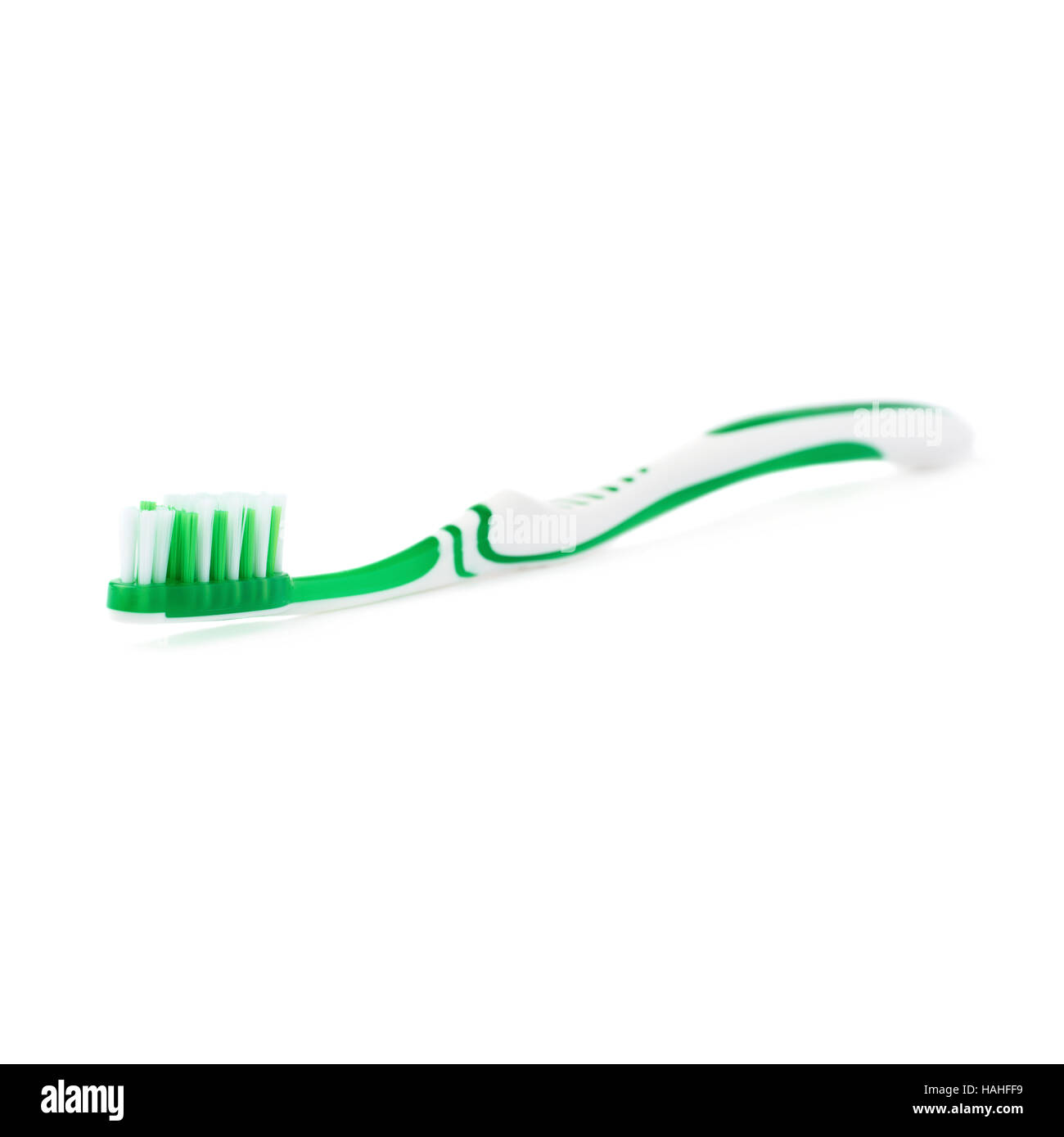 Green toothbrush isolated over white background Stock Photo - Alamy