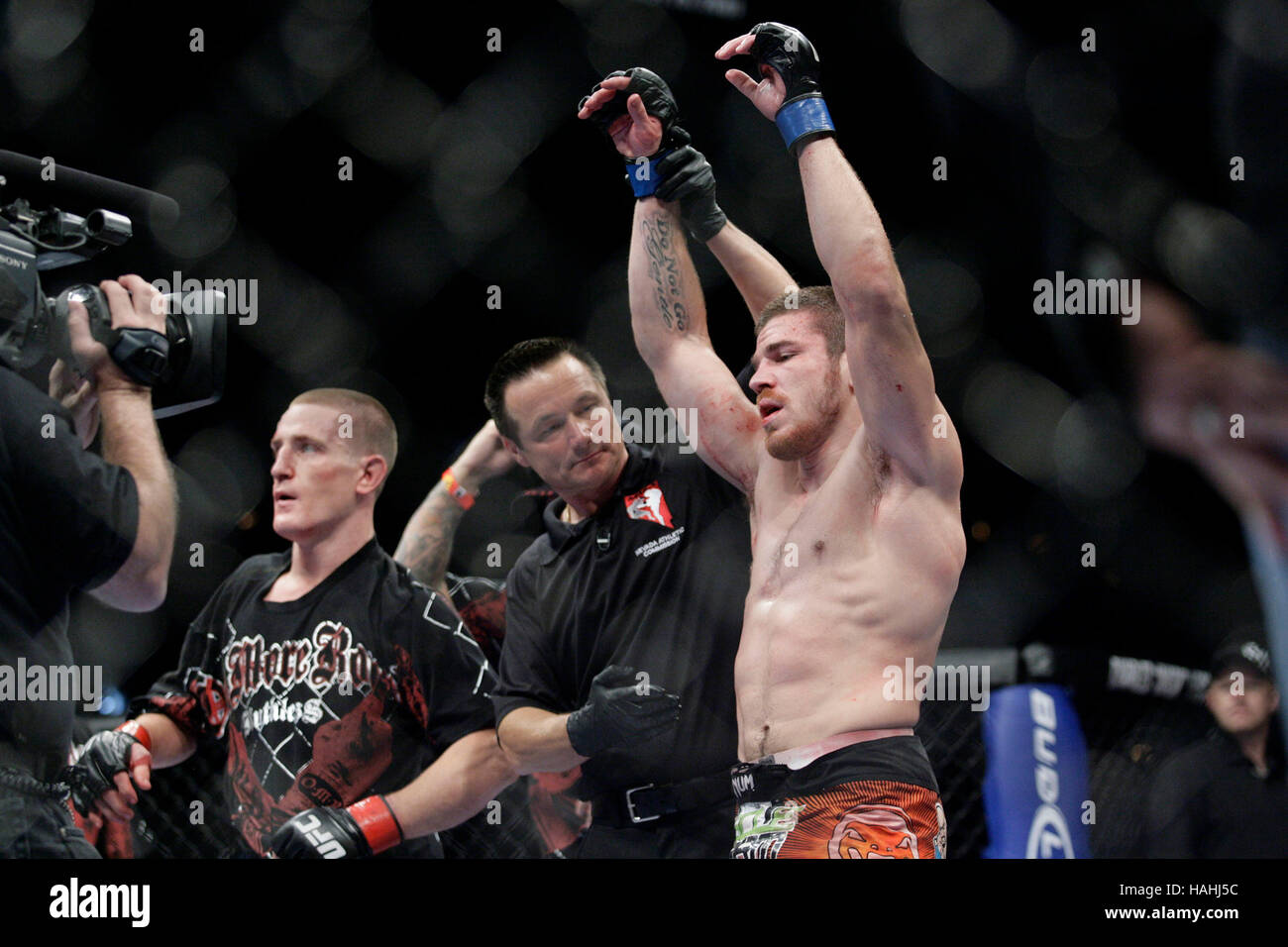 Jim Miller, right, celebrates victory over Mac Danzig during UFC 100 at ...