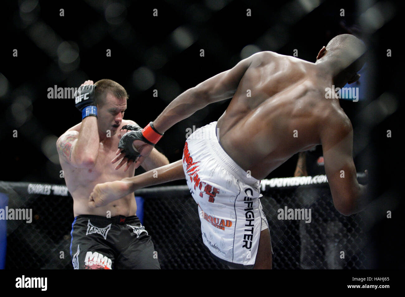 Jon Jones, right, fights Jake O'Brien during UFC 100 at the Mandalay ...