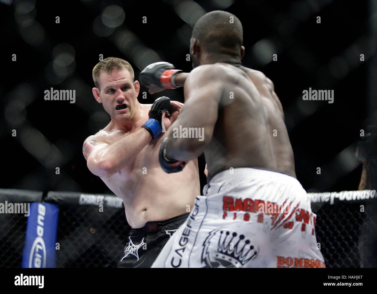 Jon Jones, right, fights Jake O'Brien during UFC 100 at the Mandalay ...