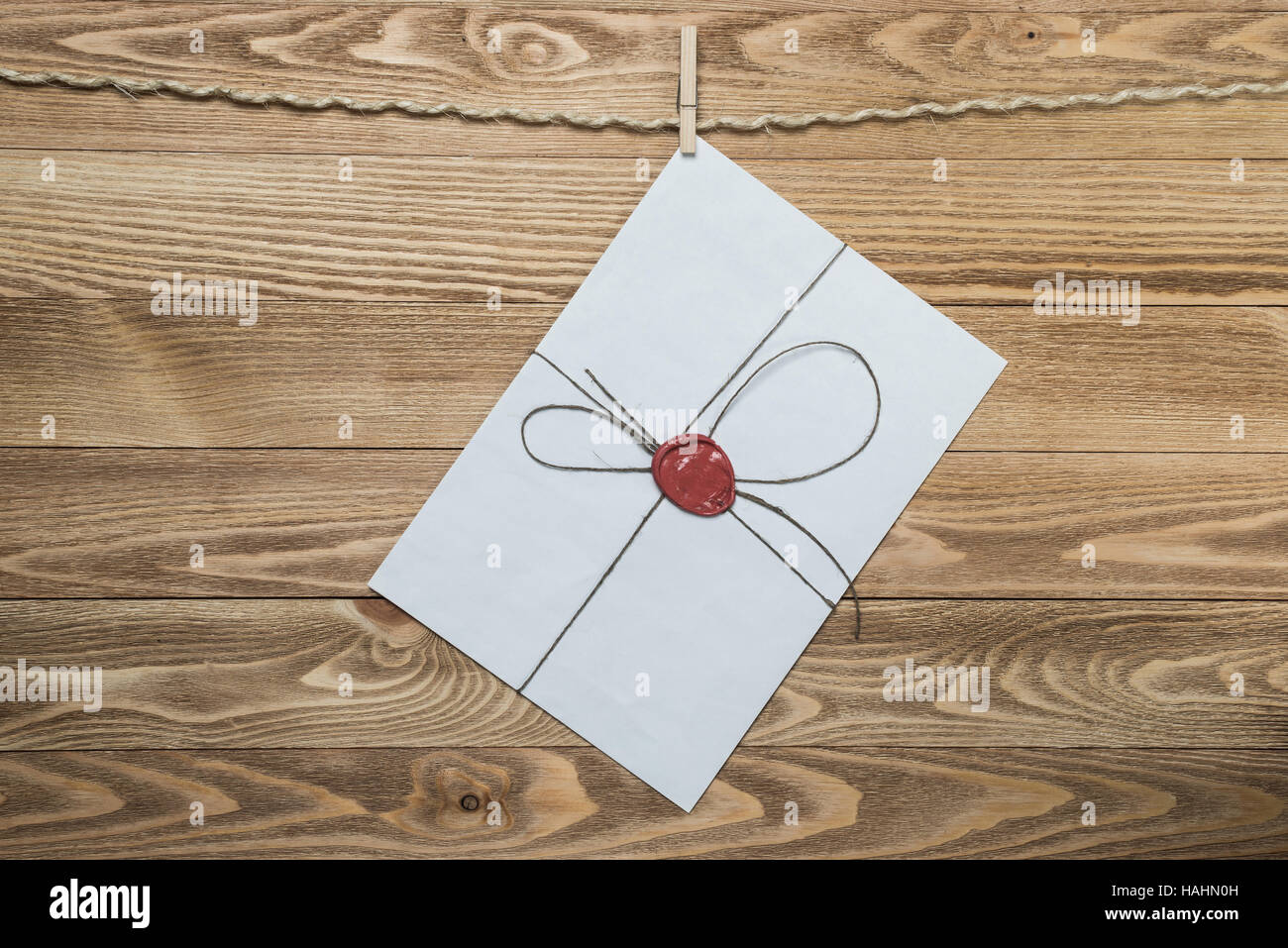 Mail envelope on rope Stock Photo - Alamy