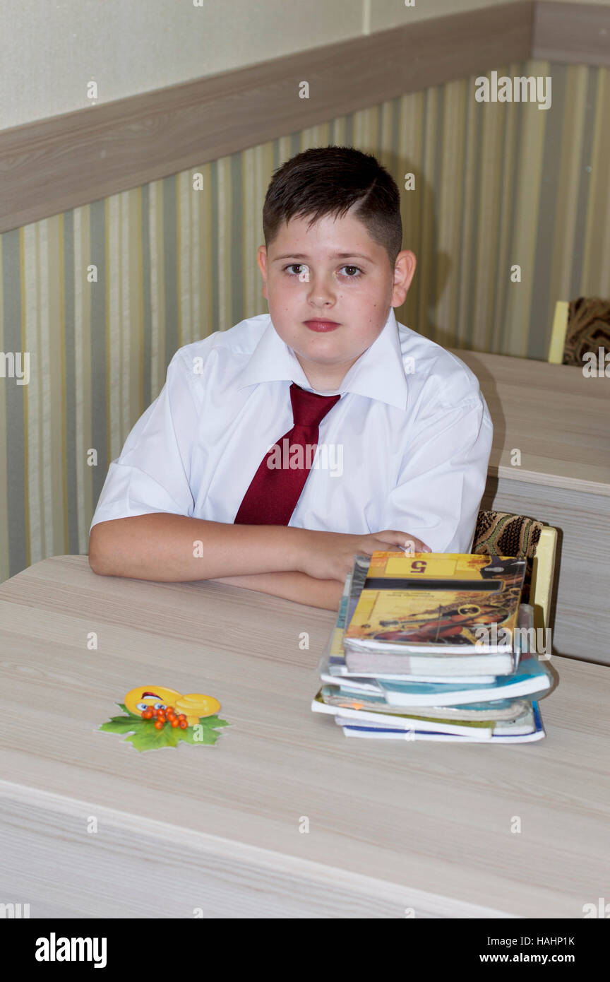 the school student behind a school desk for September 1 Stock Photo - Alamy