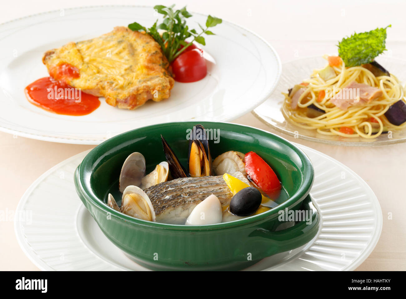 Pot of steamed snapper fish with fried fillet and spaghetti Stock Photo ...