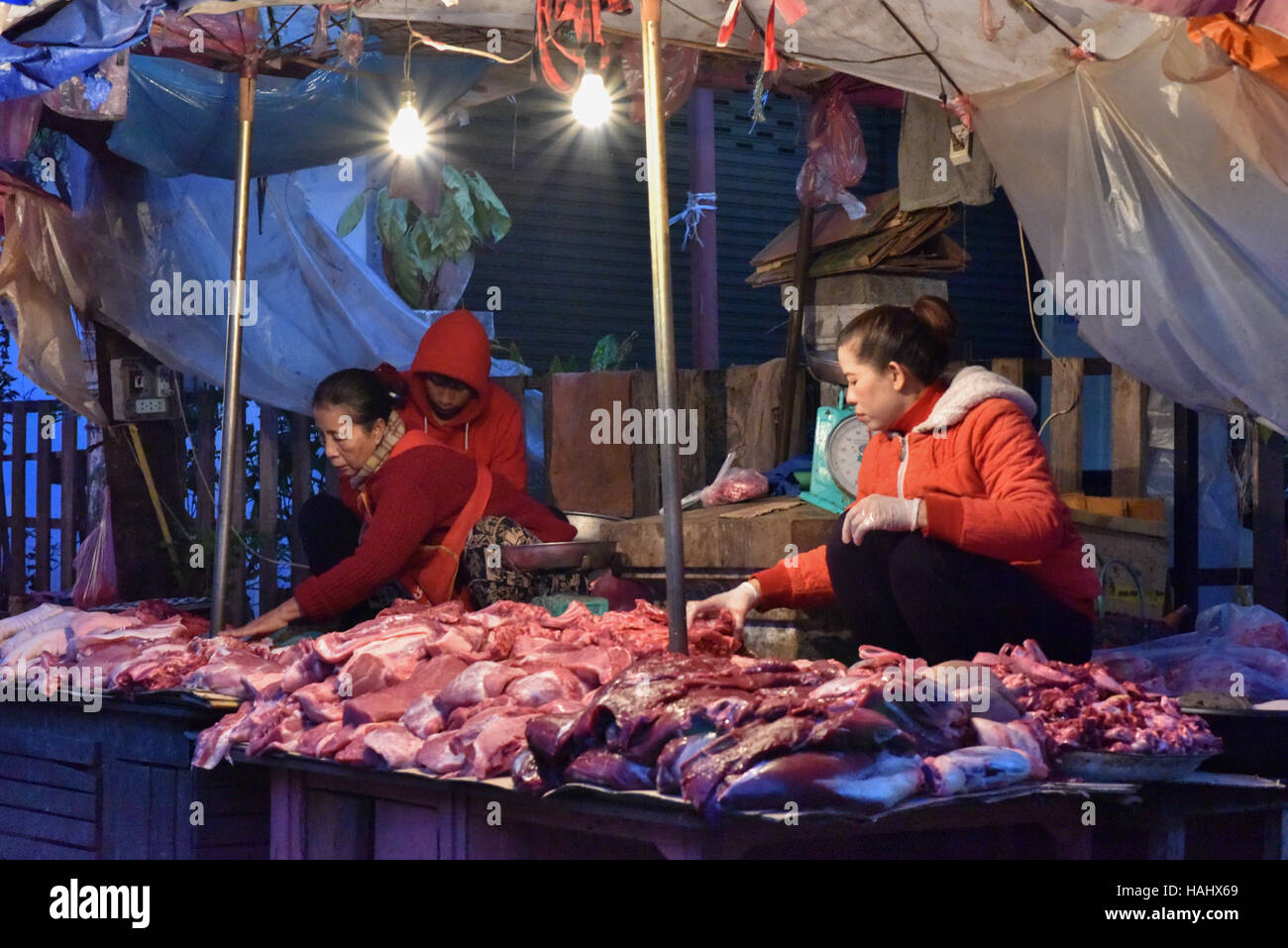 Women Selling meat Luang Prabang morning market Stock Photo - Alamy