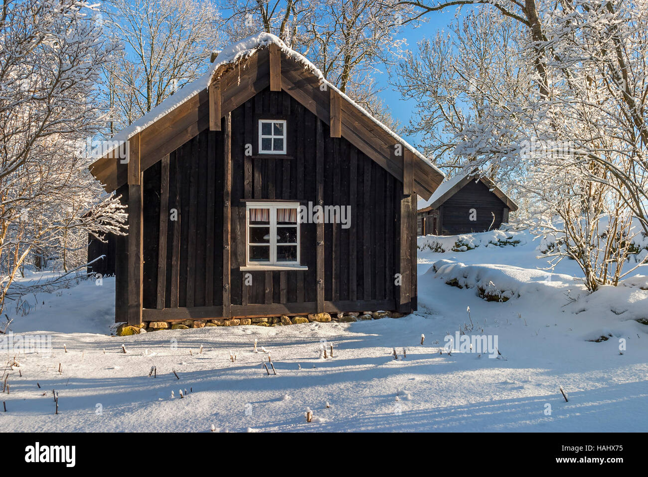 Old wooden cottage in winter landscape Stock Photo - Alamy