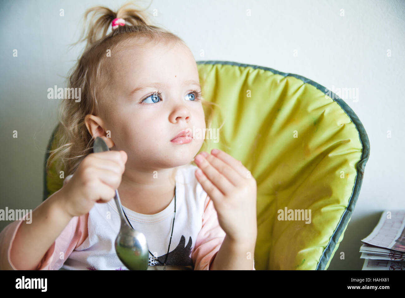 little Cute girl eating Stock Photo - Alamy