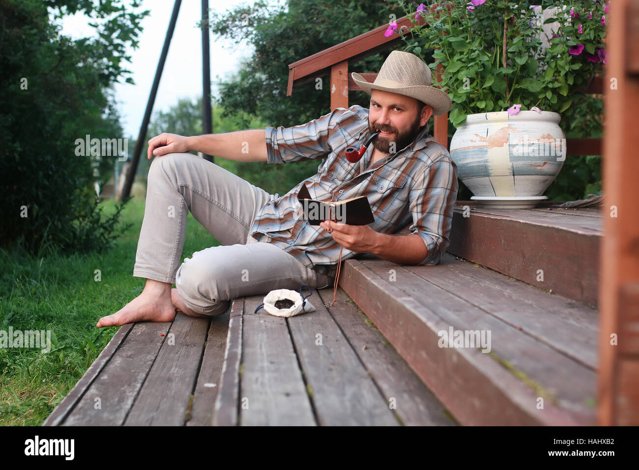 man smoke pipe outdoor Stock Photo - Alamy