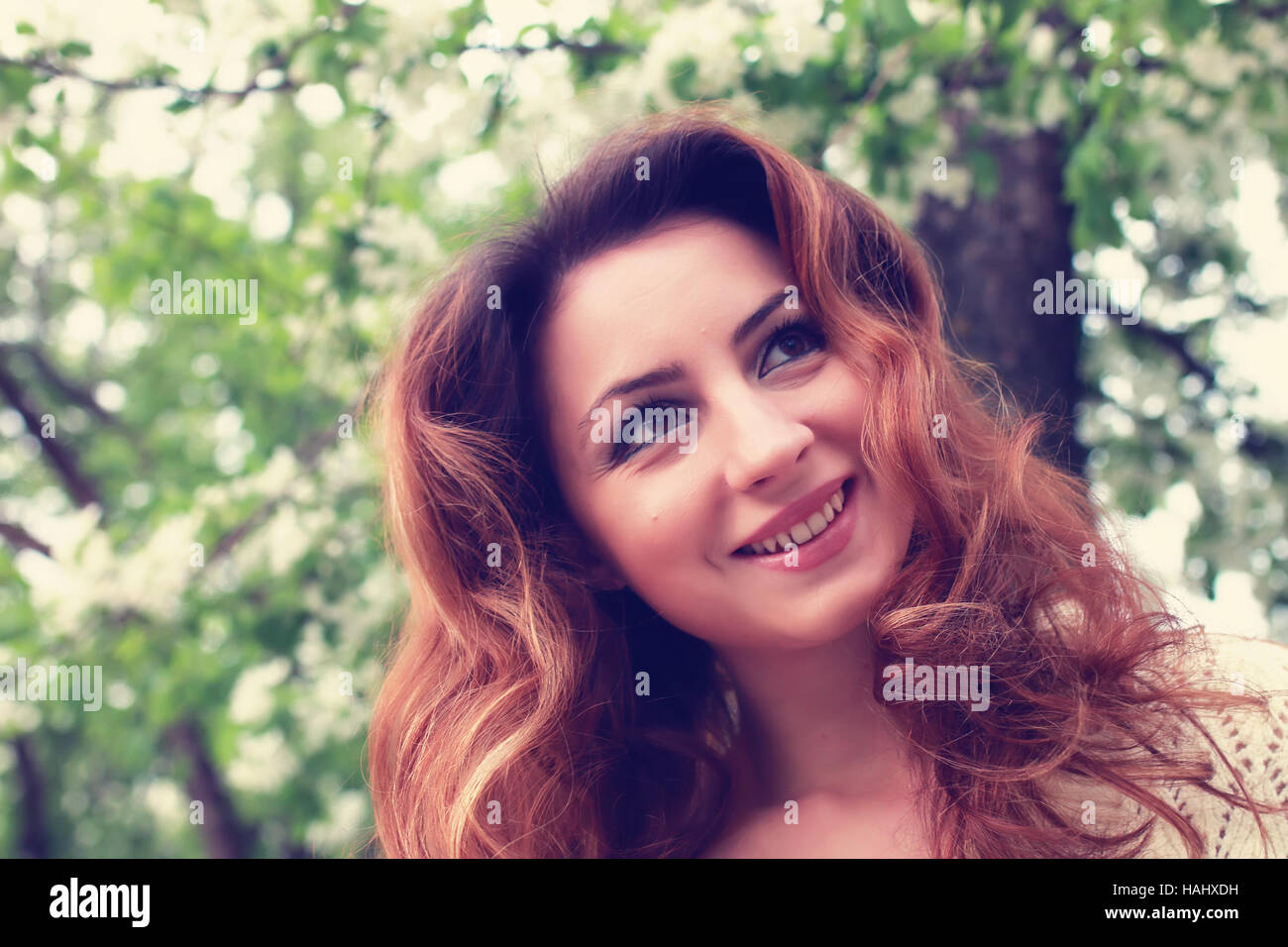 girl walking in spring apple alley Stock Photo - Alamy
