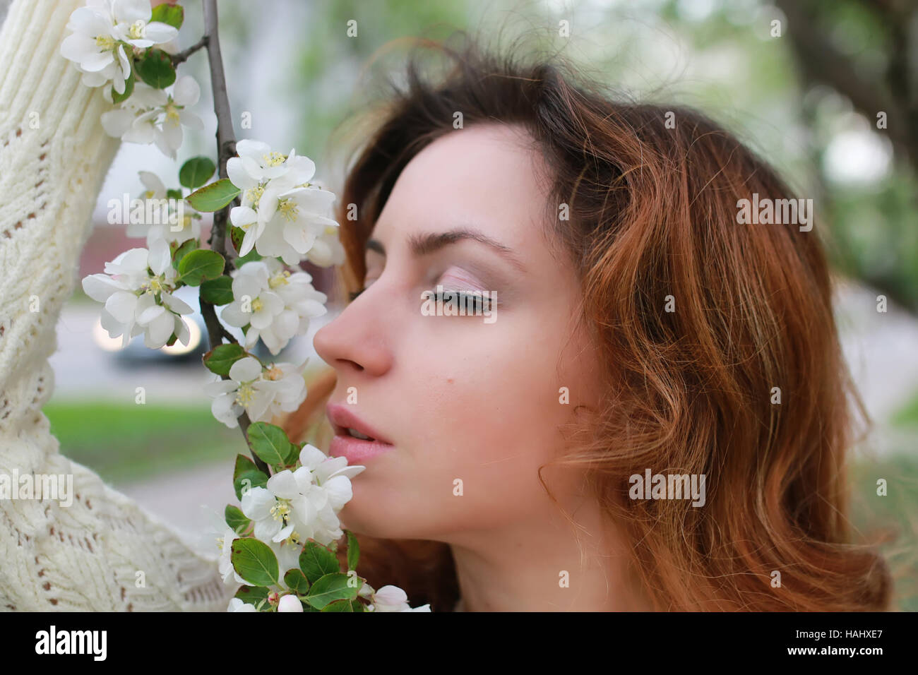 woman smell tree flower Stock Photo - Alamy