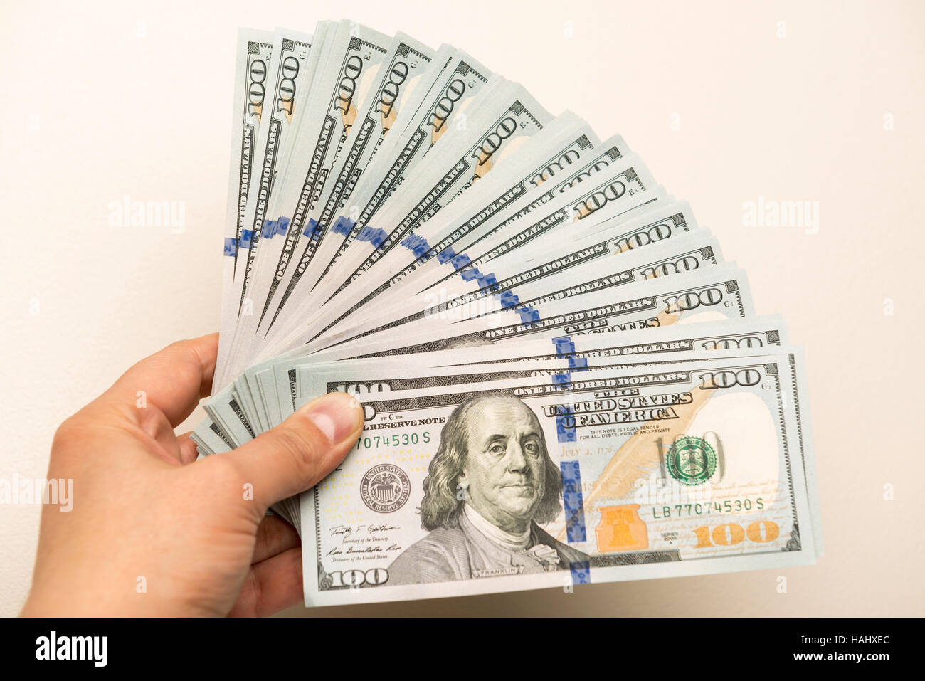 Many hundred dollar bank notes Stock Photo - Alamy