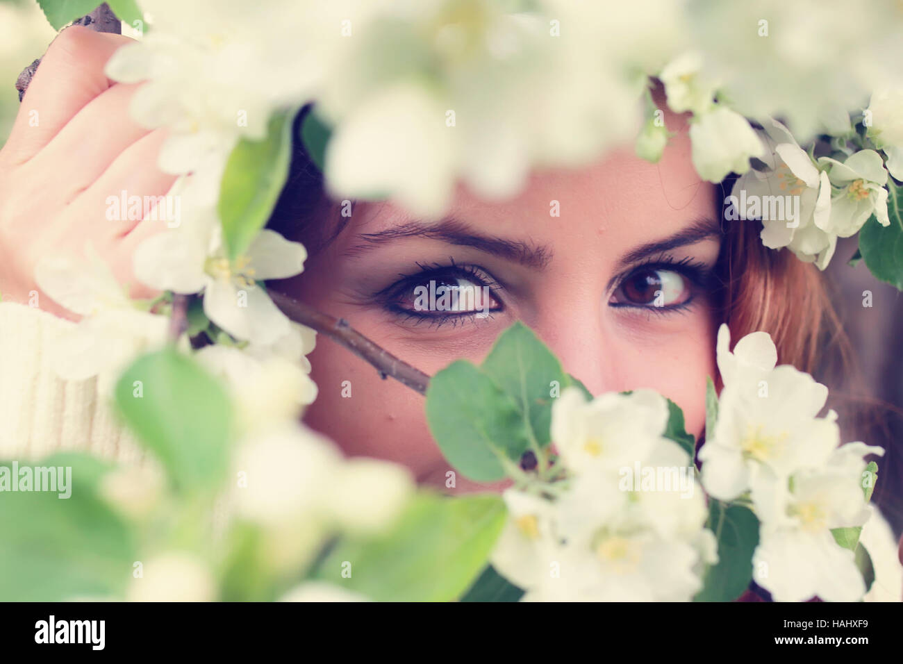 girl eye in branch tree flower Stock Photo - Alamy