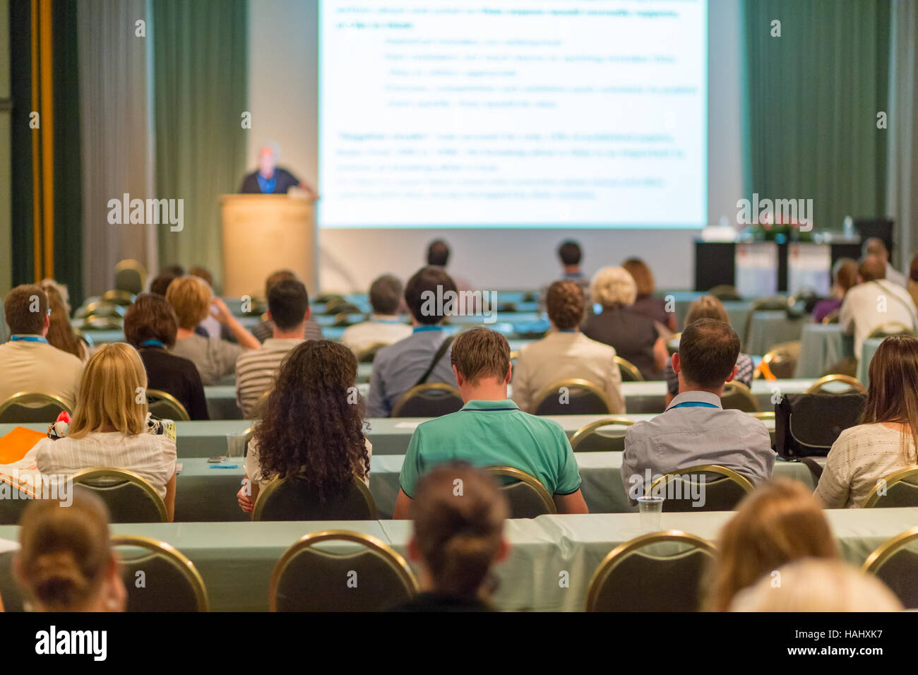 Audience in lecture hall participating at business conference Stock ...