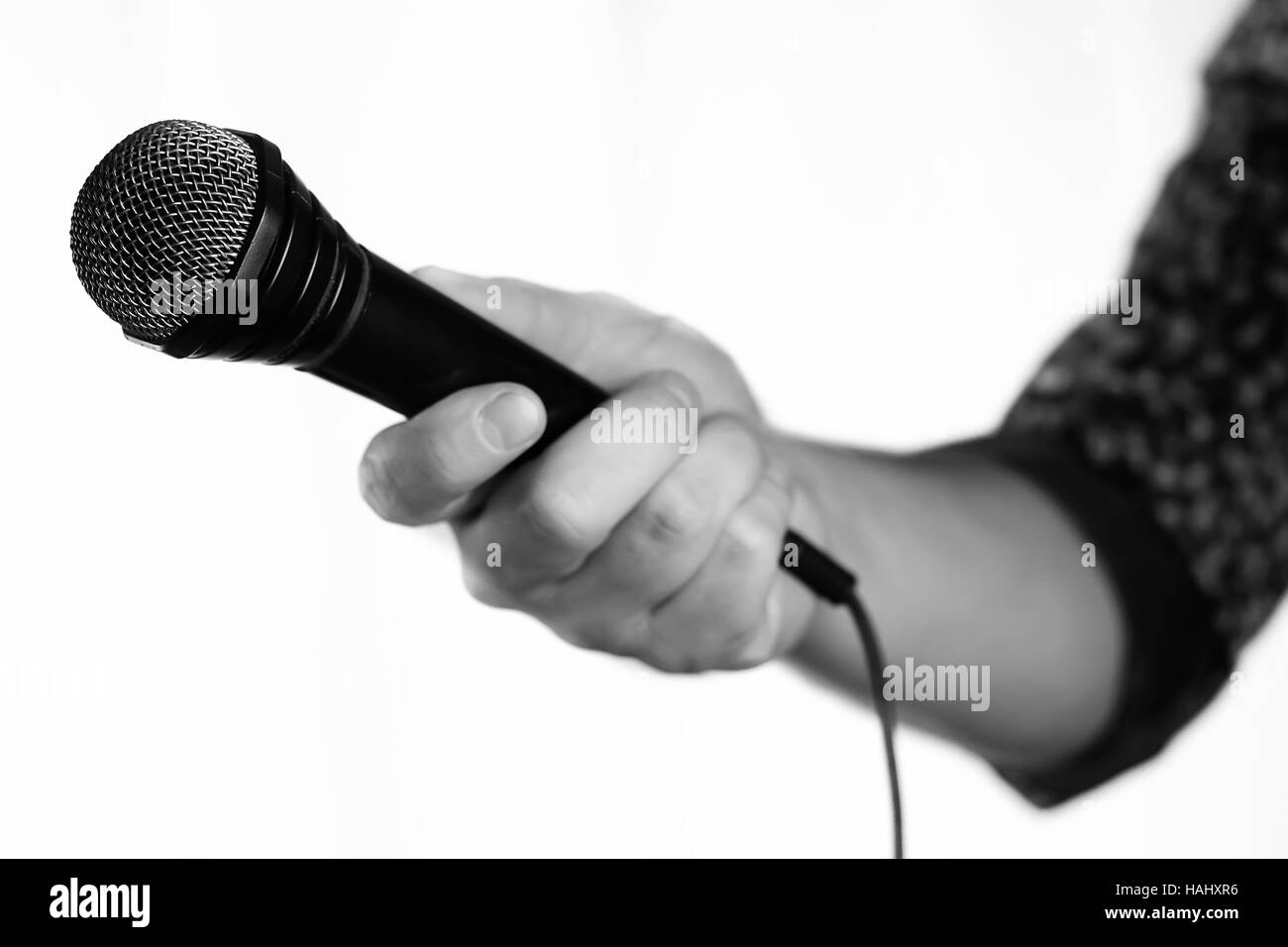 Microphone isolated man hand Stock Photo - Alamy