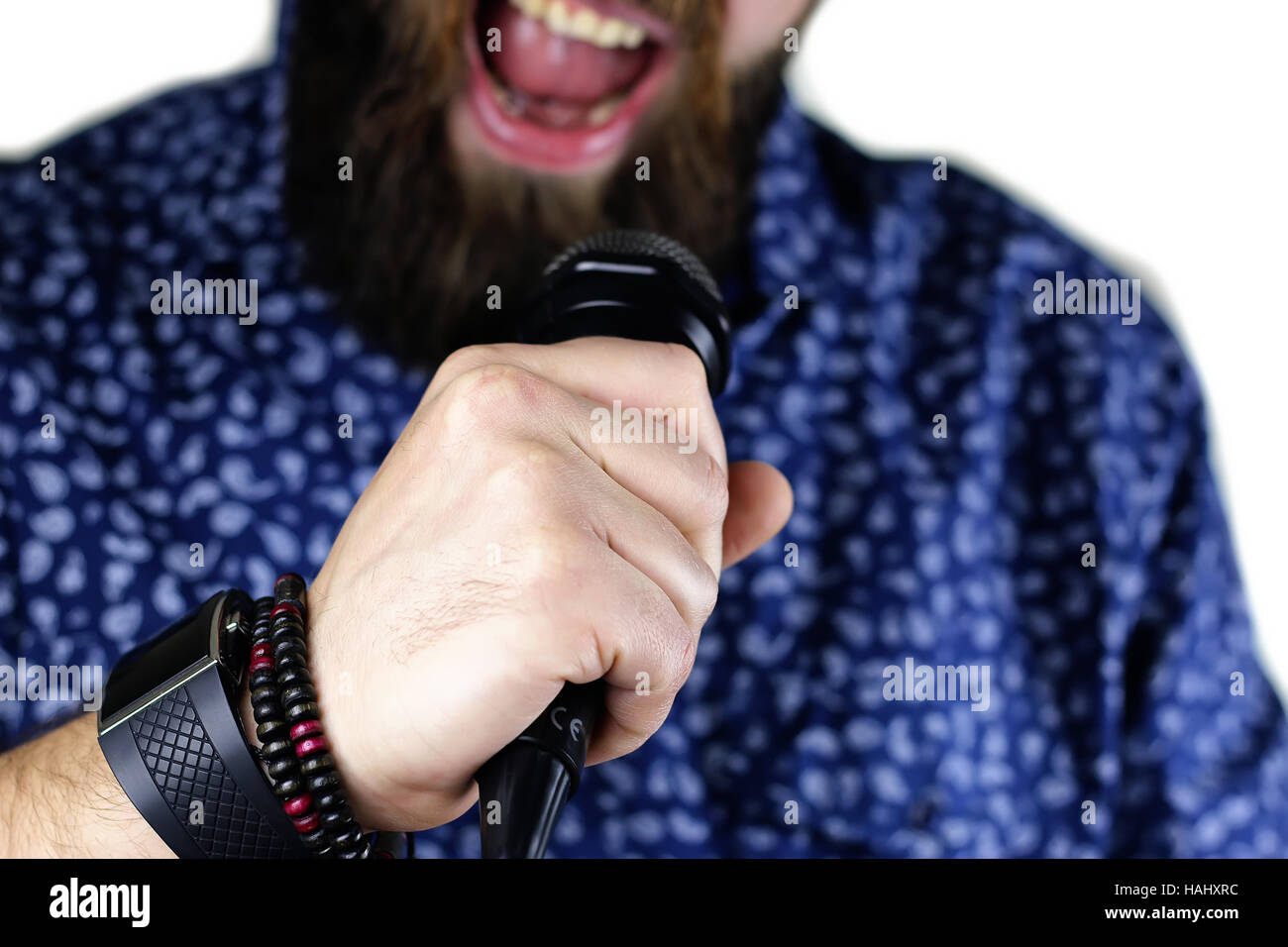 microphone on stage hand hold Stock Photo - Alamy