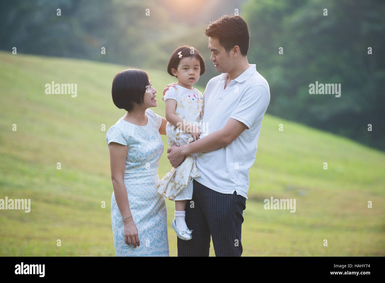 Happy Asian Family enjoying family time together in the park Stock ...