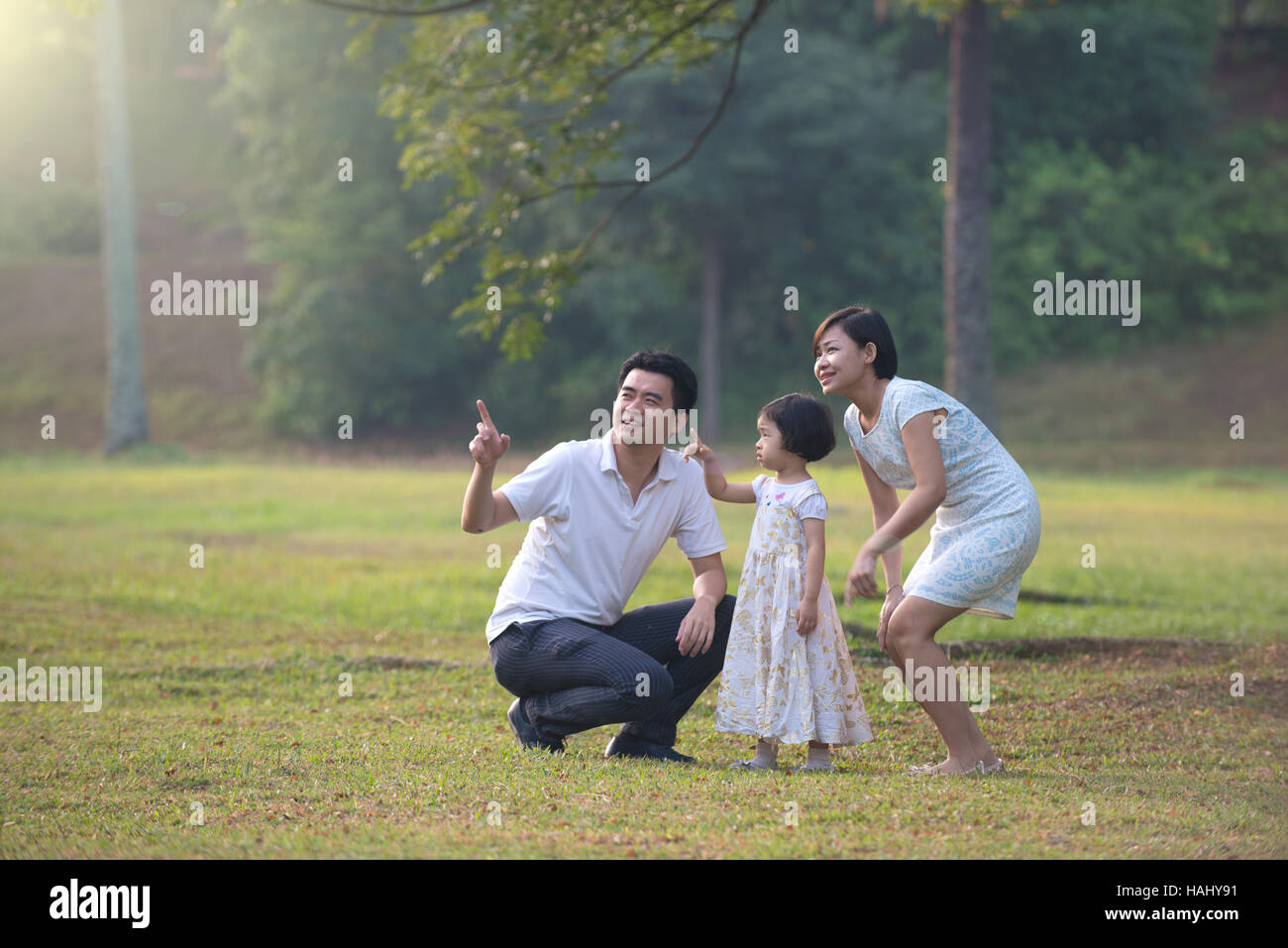 Happy Asian Family enjoying family time together in the park Stock ...