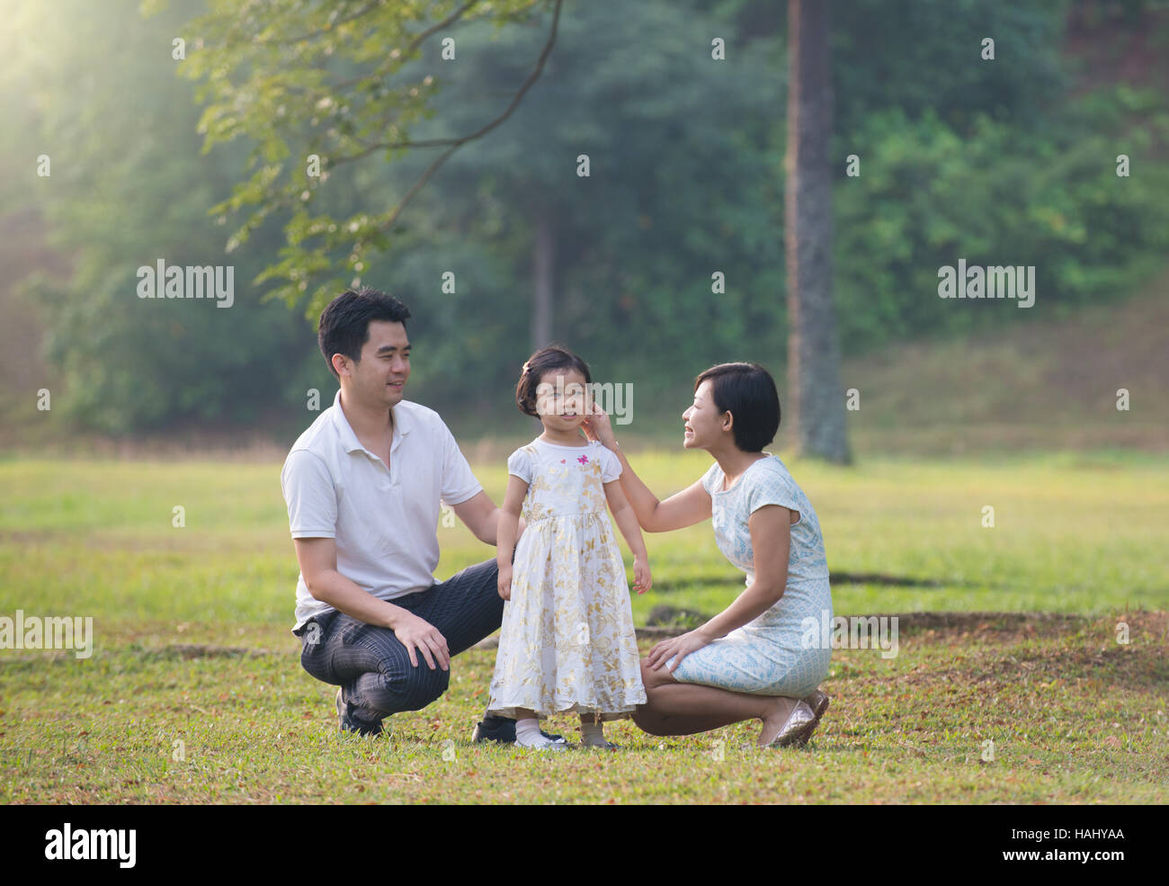 Happy Asian Family enjoying family time together in the park Stock Photo - Alamy