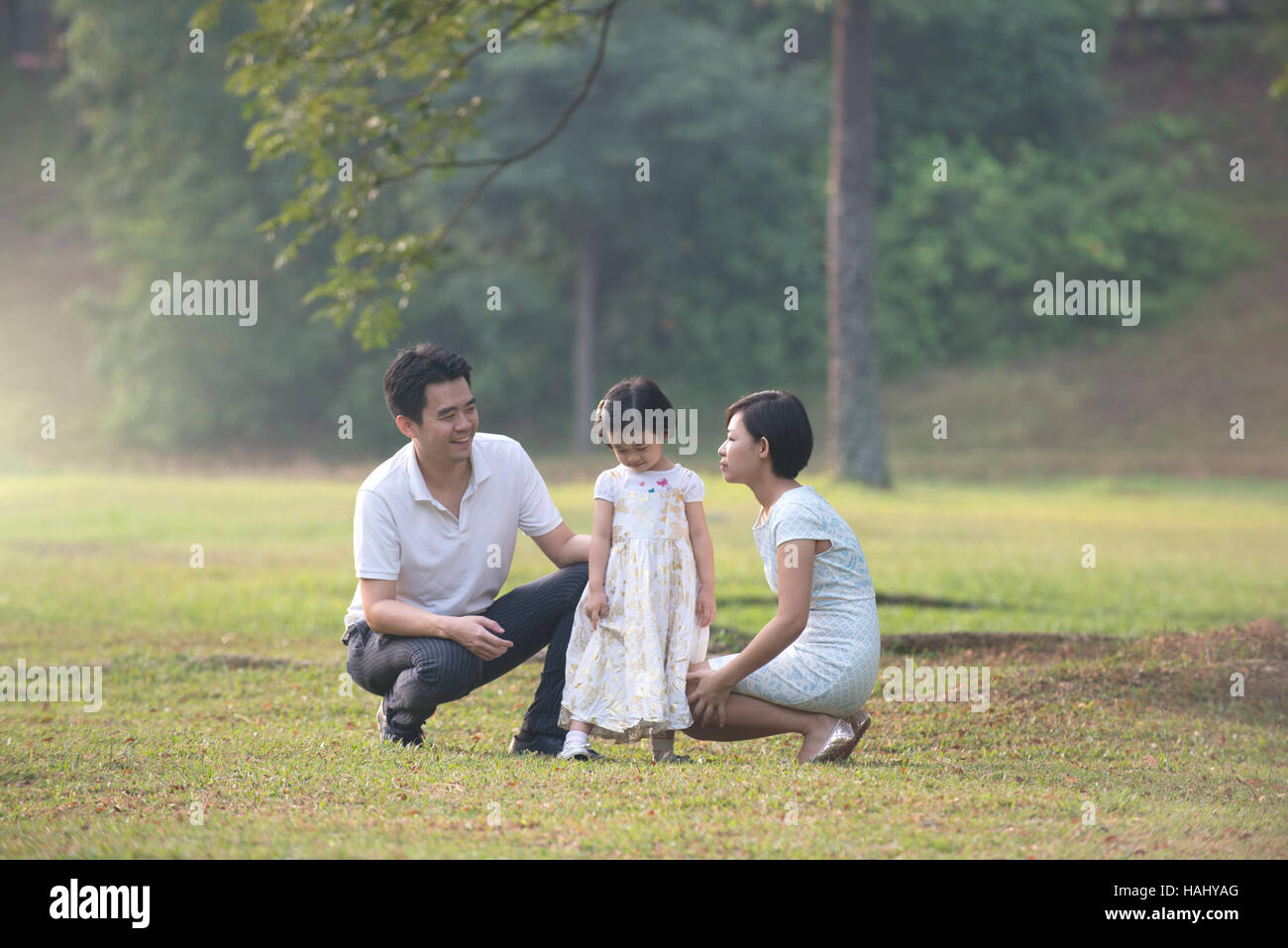 Happy Asian Family enjoying family time together in the park Stock ...