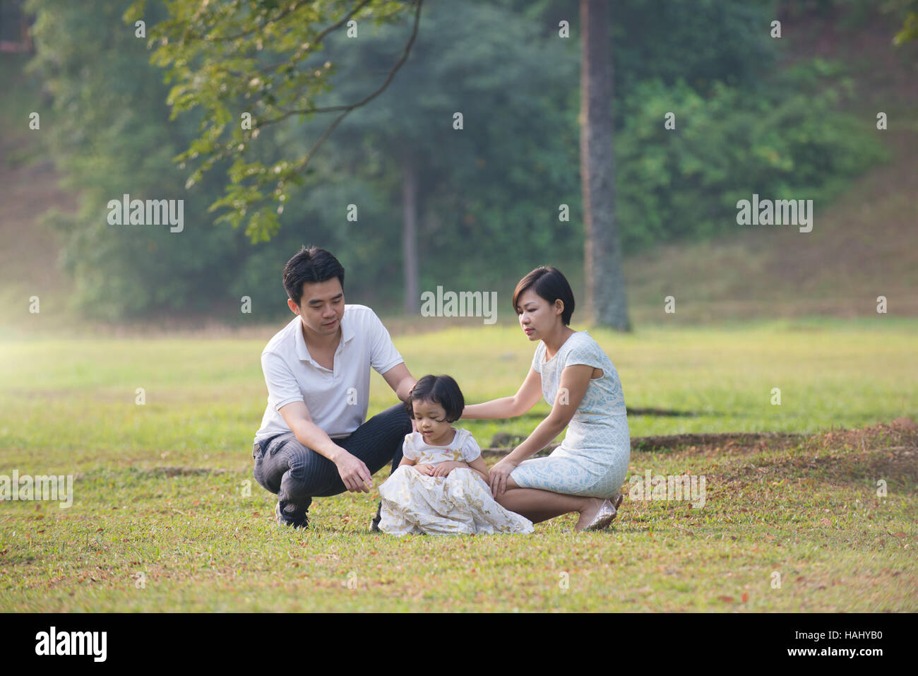 Happy Asian Family enjoying family time together in the park Stock Photo - Alamy