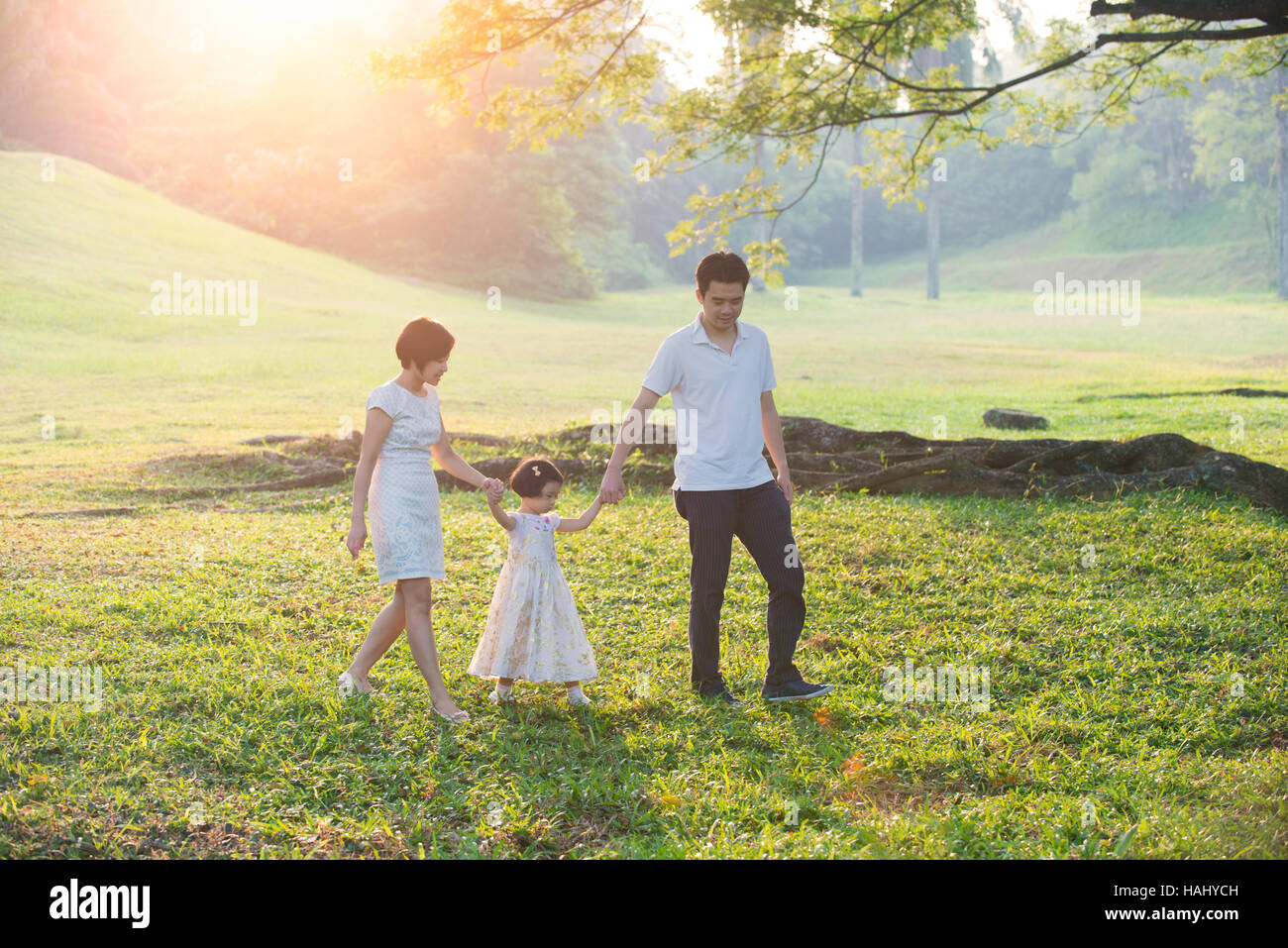 Happy Asian Family enjoying family time together in the park Stock ...