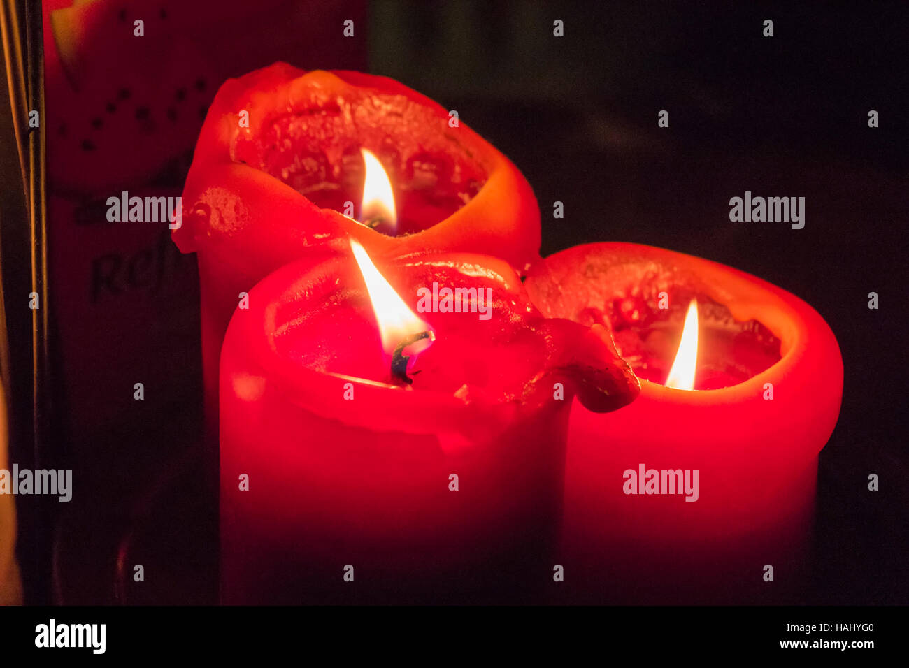 Three red candles hi-res stock photography and images - Alamy