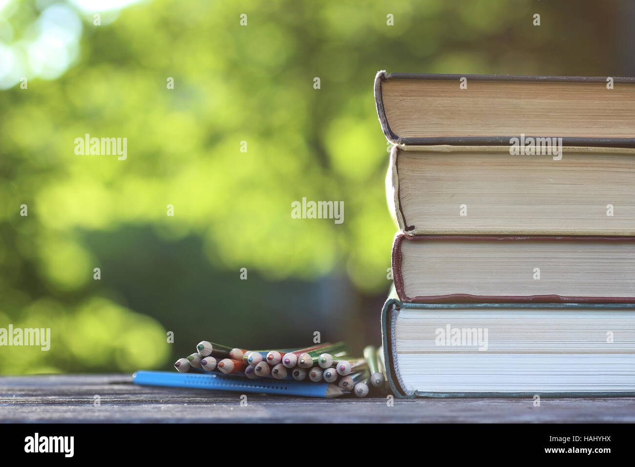 book stack background table wooden outdoor Stock Photo - Alamy