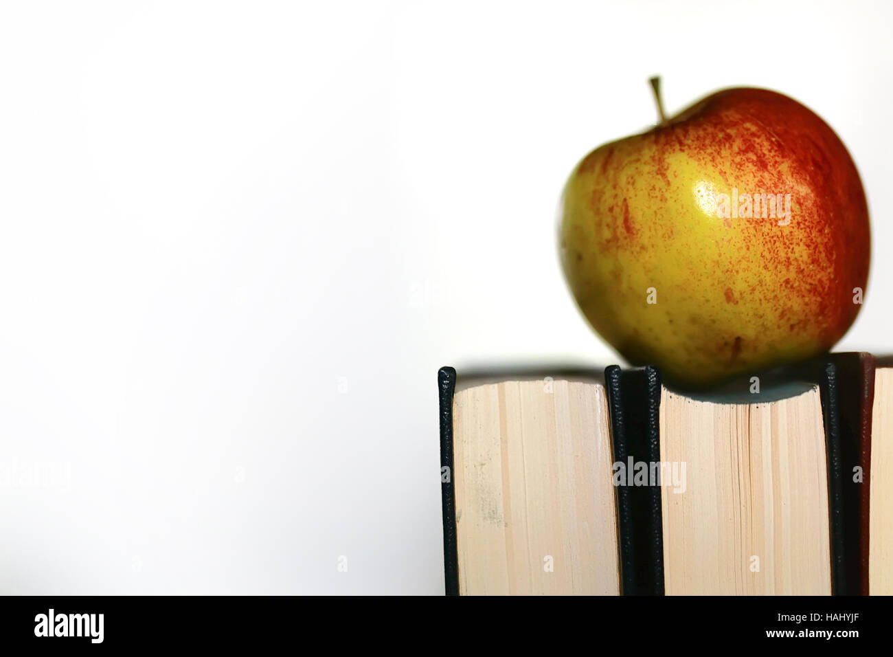 education concept books stack, apple and pen Stock Photo - Alamy
