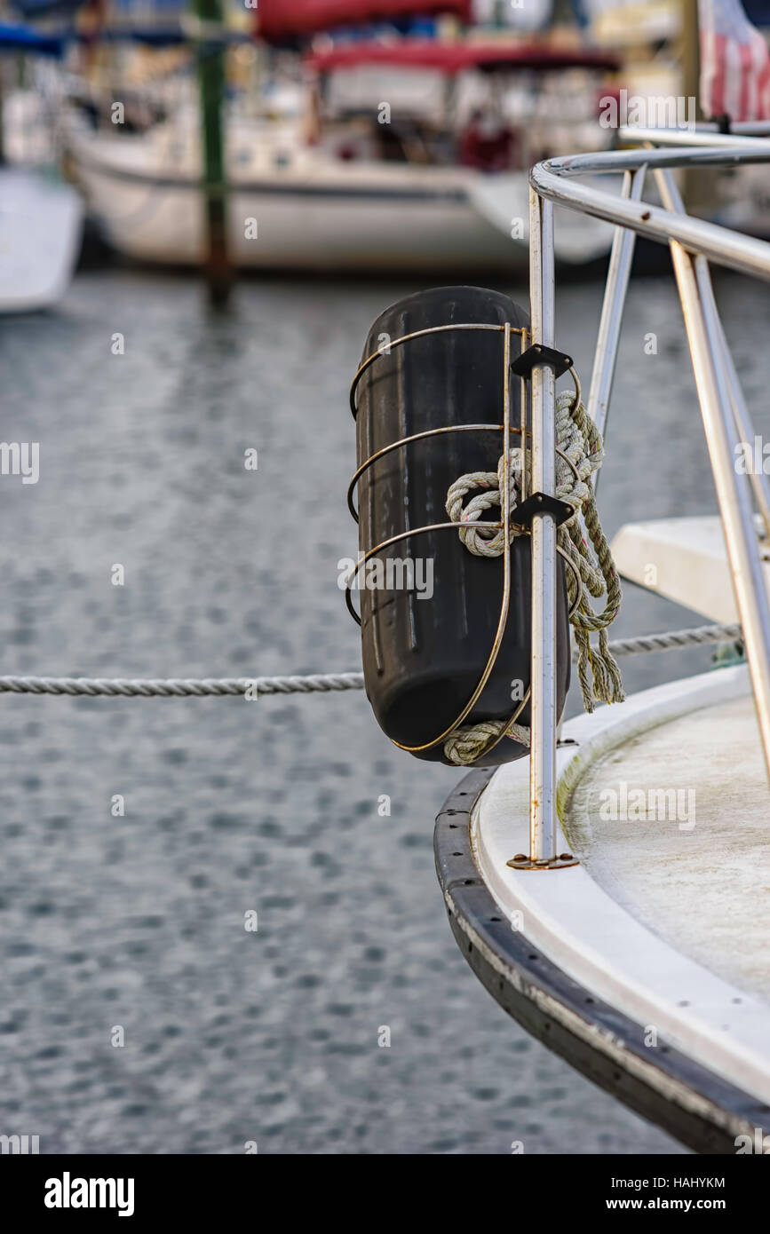 Black boat fender on side of boat Stock Photo - Alamy