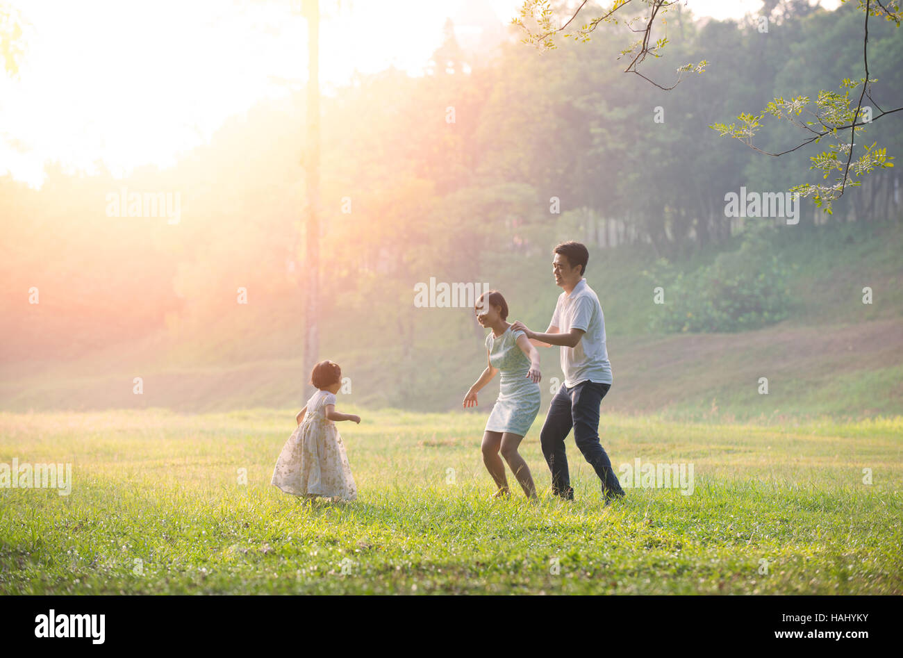 Happy Asian Family enjoying family time together in the park Stock ...