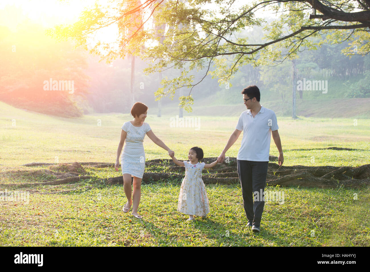Happy Asian Family enjoying family time together in the park Stock ...