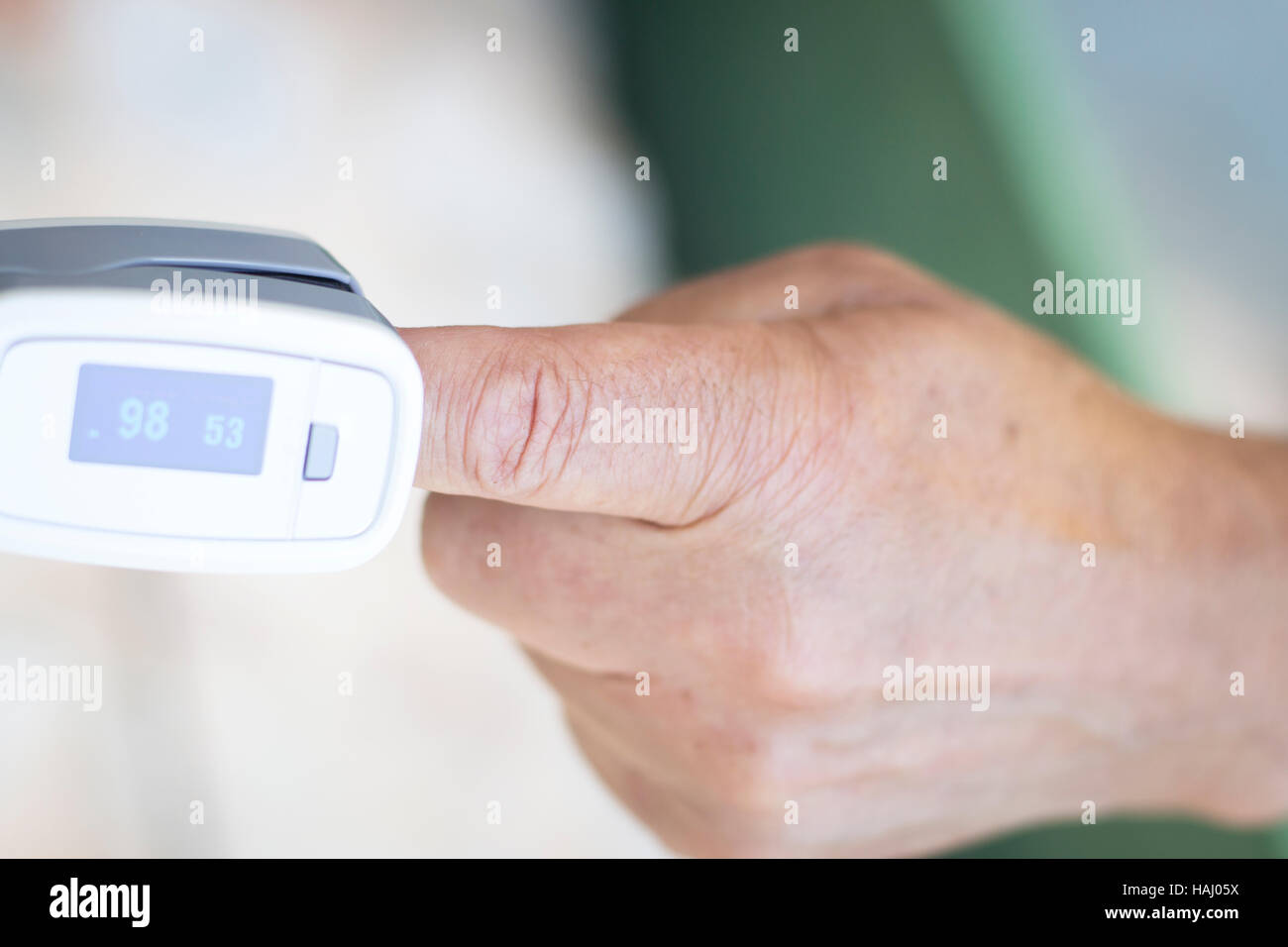 Portable hand held domestic cardiac finger pulse rate meter to show ...