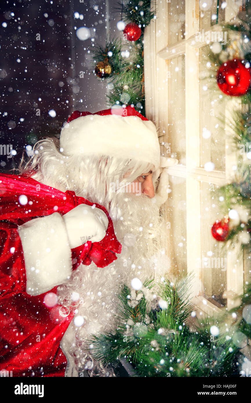Portrait of Santa Claus. Santa Claus looks out the window Stock Photo ...