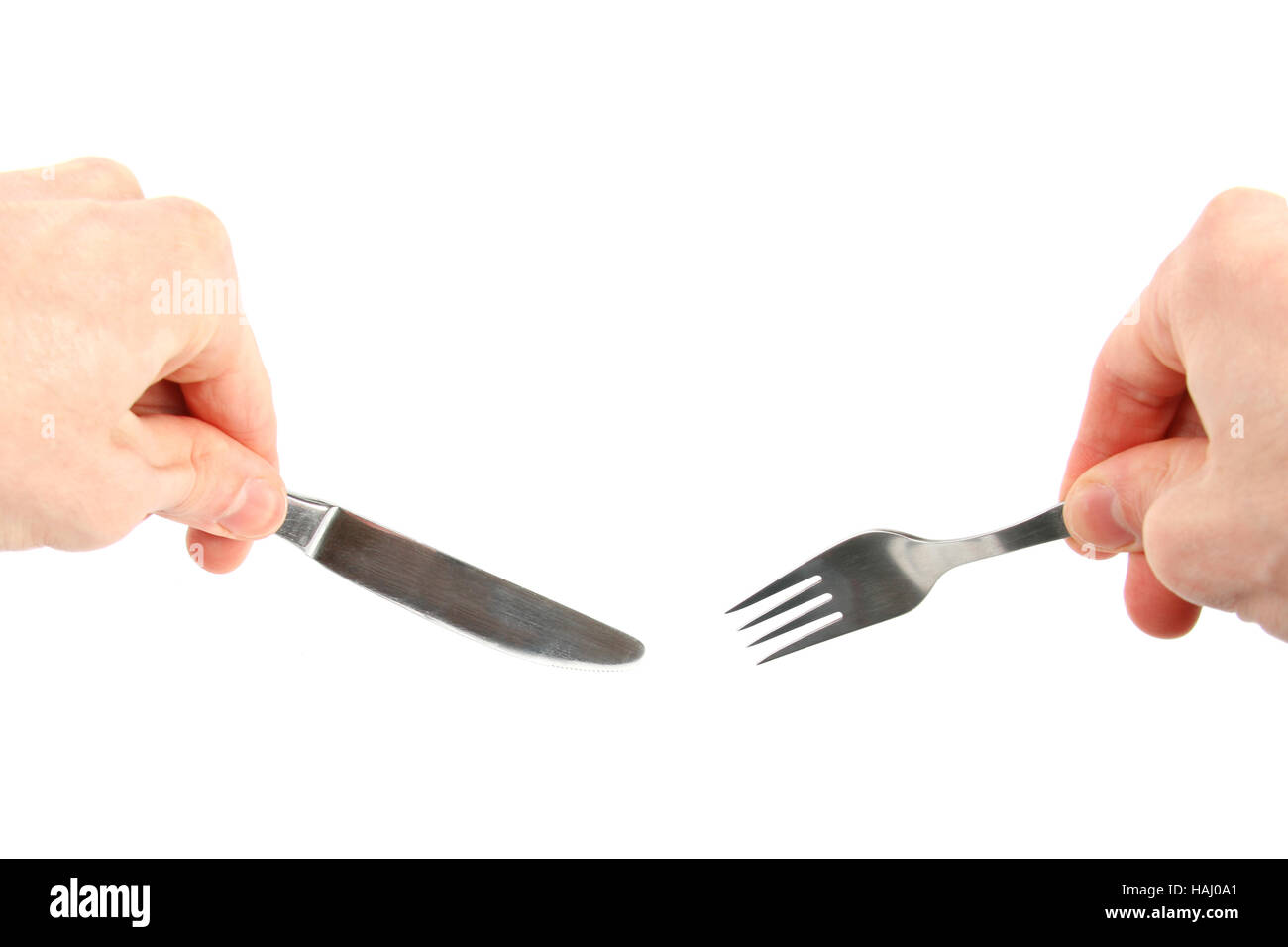 Knife and fork in hands Stock Photo - Alamy