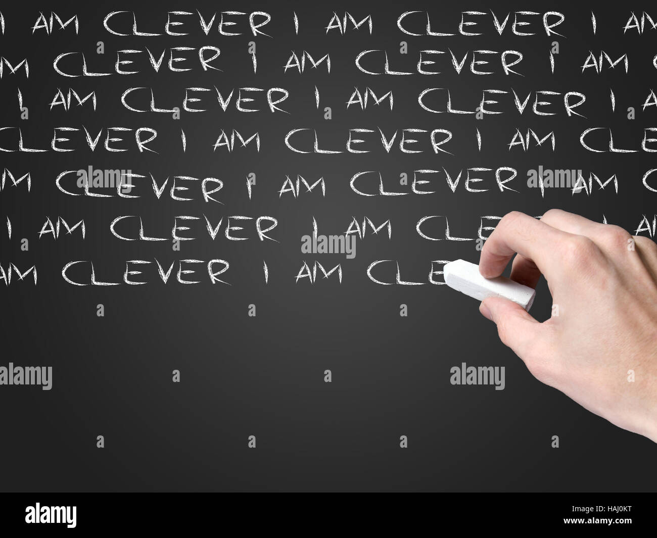 Hand written "i am clever" on blackboard Stock Photo - Alamy