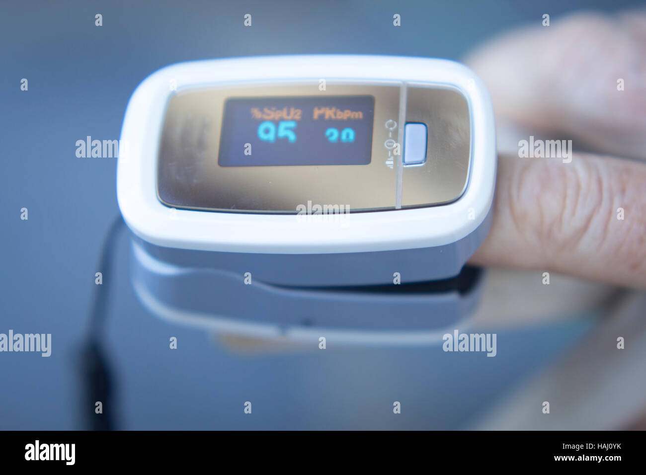 Portable hand held domestic cardiac finger pulse rate meter to show ...