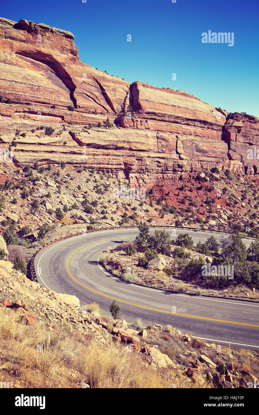 Vintage toned scenic curved road, travel concept background, Colorado ...