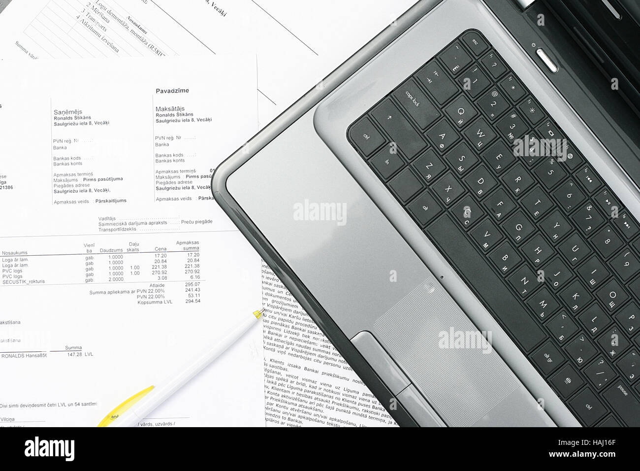 laptop and paper bills on the table Stock Photo - Alamy