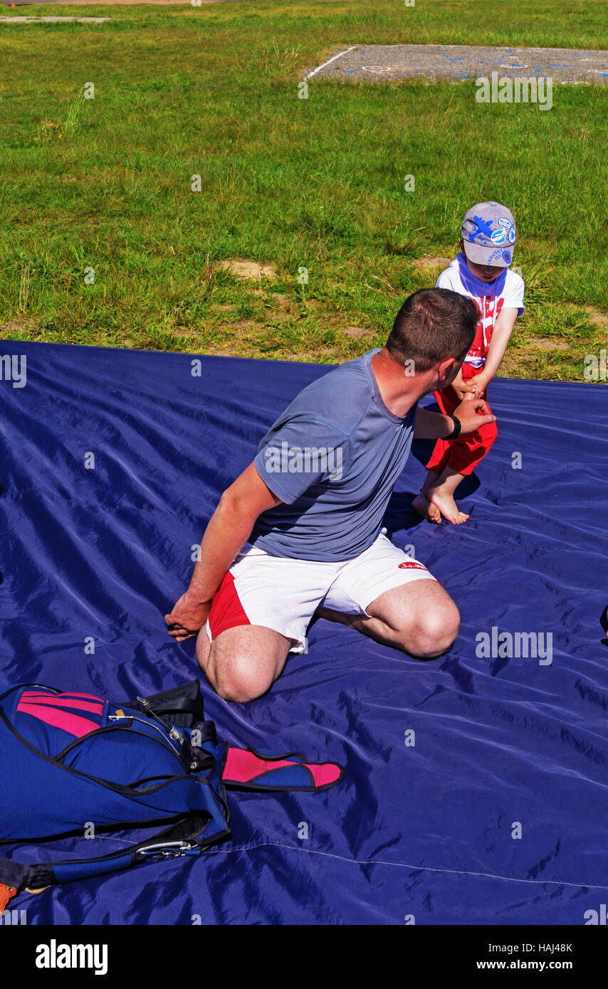 Parachutists - 2015.Skydivers and their child Stock Photo - Alamy
