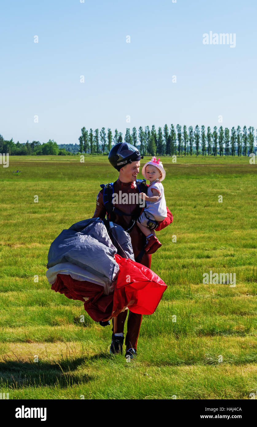 Parachutists - 2015.After landing.Skydiver and their child Stock Photo ...