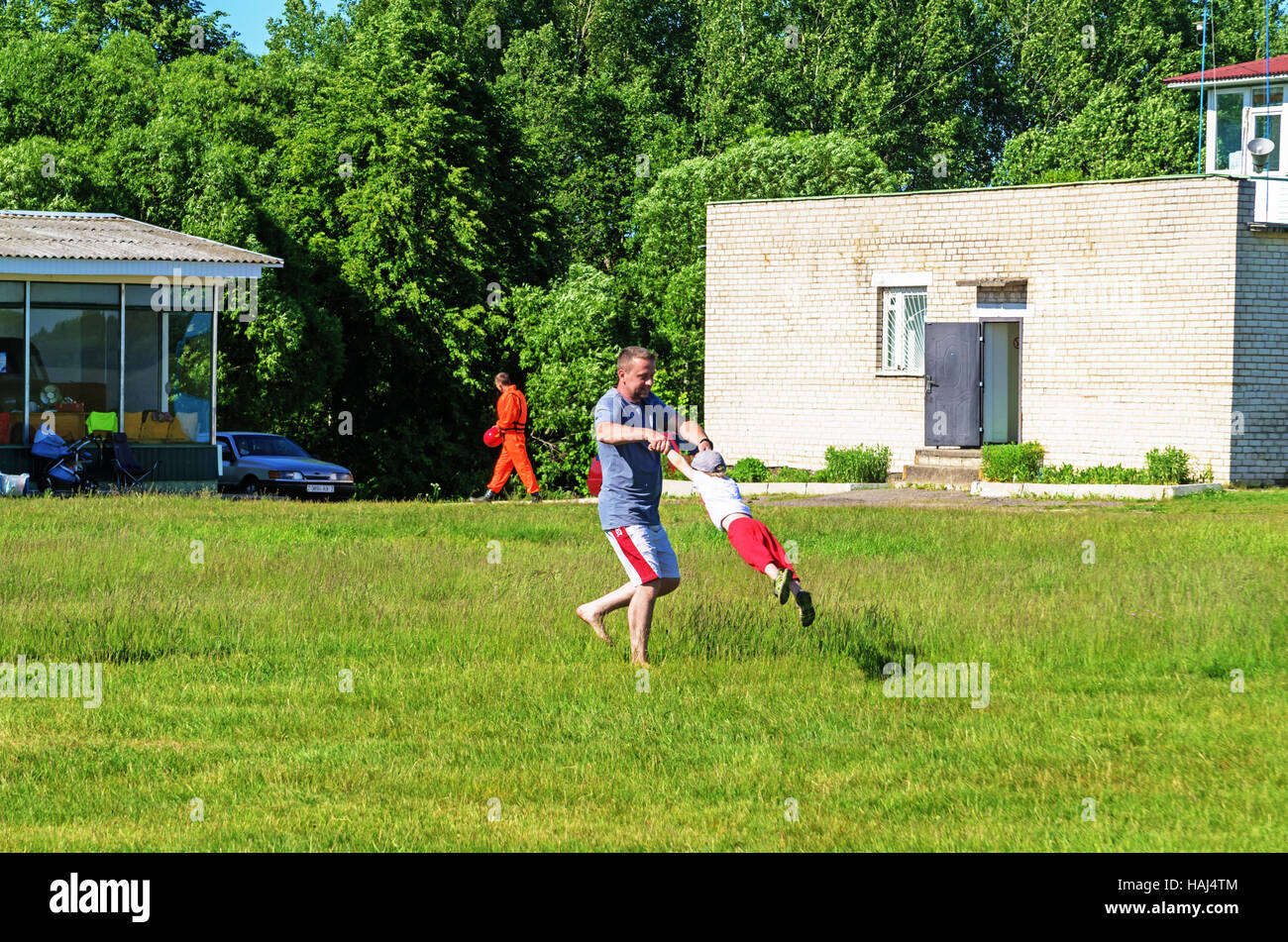 Parachutists - 2015.Skydivers and their child Stock Photo - Alamy