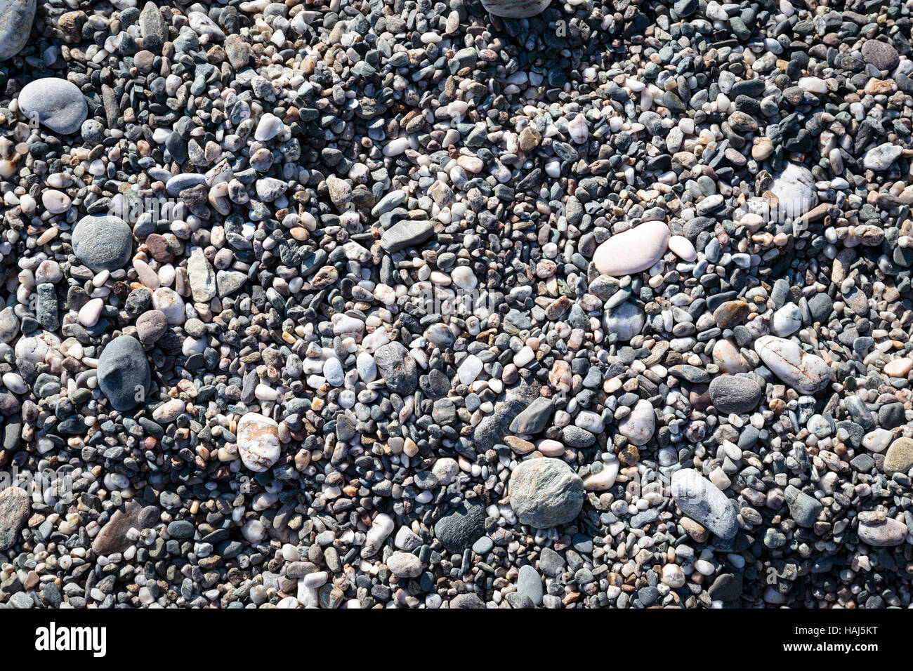 Pebbles on a beach in Sicily Stock Photo - Alamy