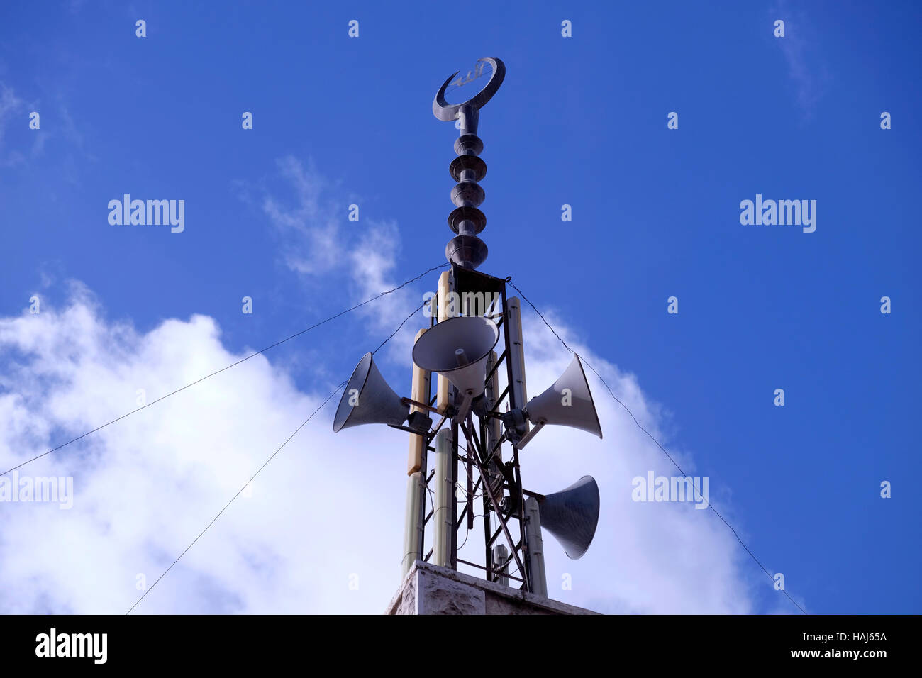 Loudspeakers attached to a decorated finial of a small mosque in Beit ...
